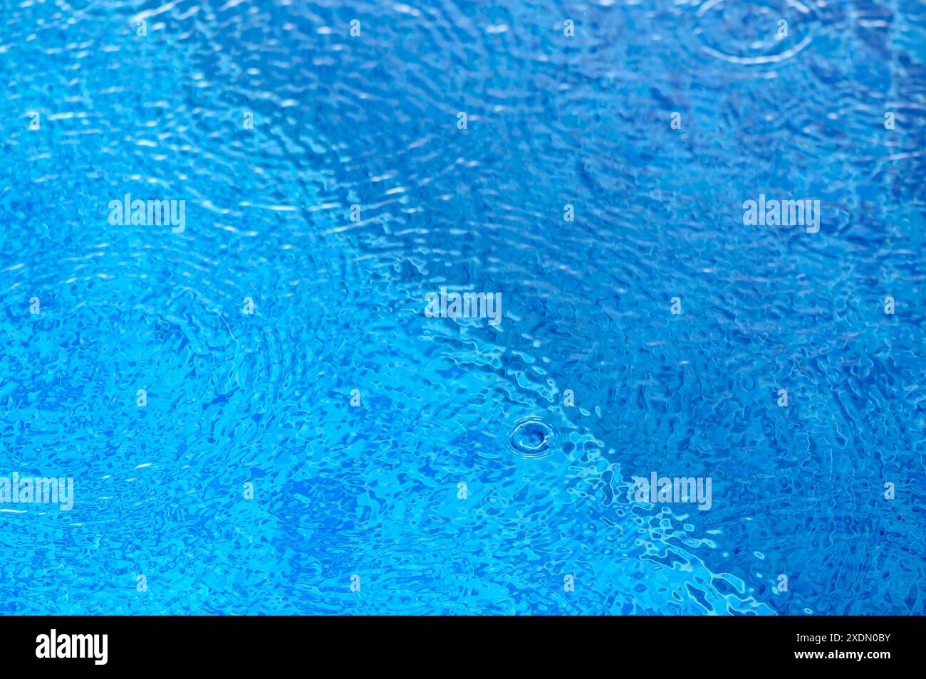 drops of water on the surface of the water in the pool 7 Stock Photo ...