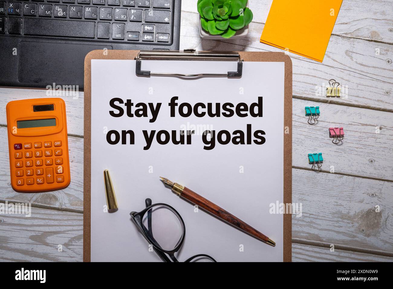 Inspirational quote - Stay focused on your goals. With text message on ...