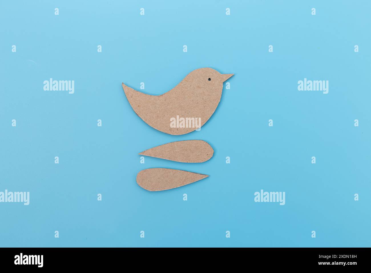 The main body of the bird is in brown cardboard color. process of ...