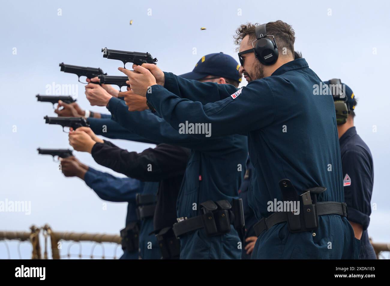 Fire Controlman 2nd Class Christopher Gonzalez shoot the M9 service ...