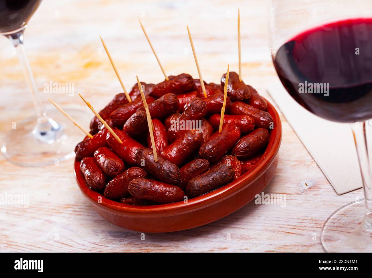 Spanish appetizer, warm mini chorizo sausages Stock Photo - Alamy