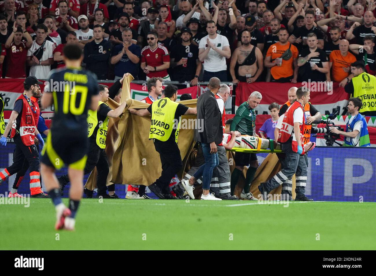 Hungary's Barnabas Varga leaves the pitch on a stretcher following a ...