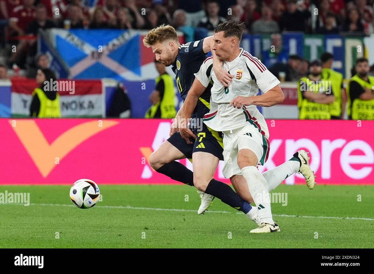 Scotland's Stuart Armstrong (left) is brought down by Hungary's Willi ...