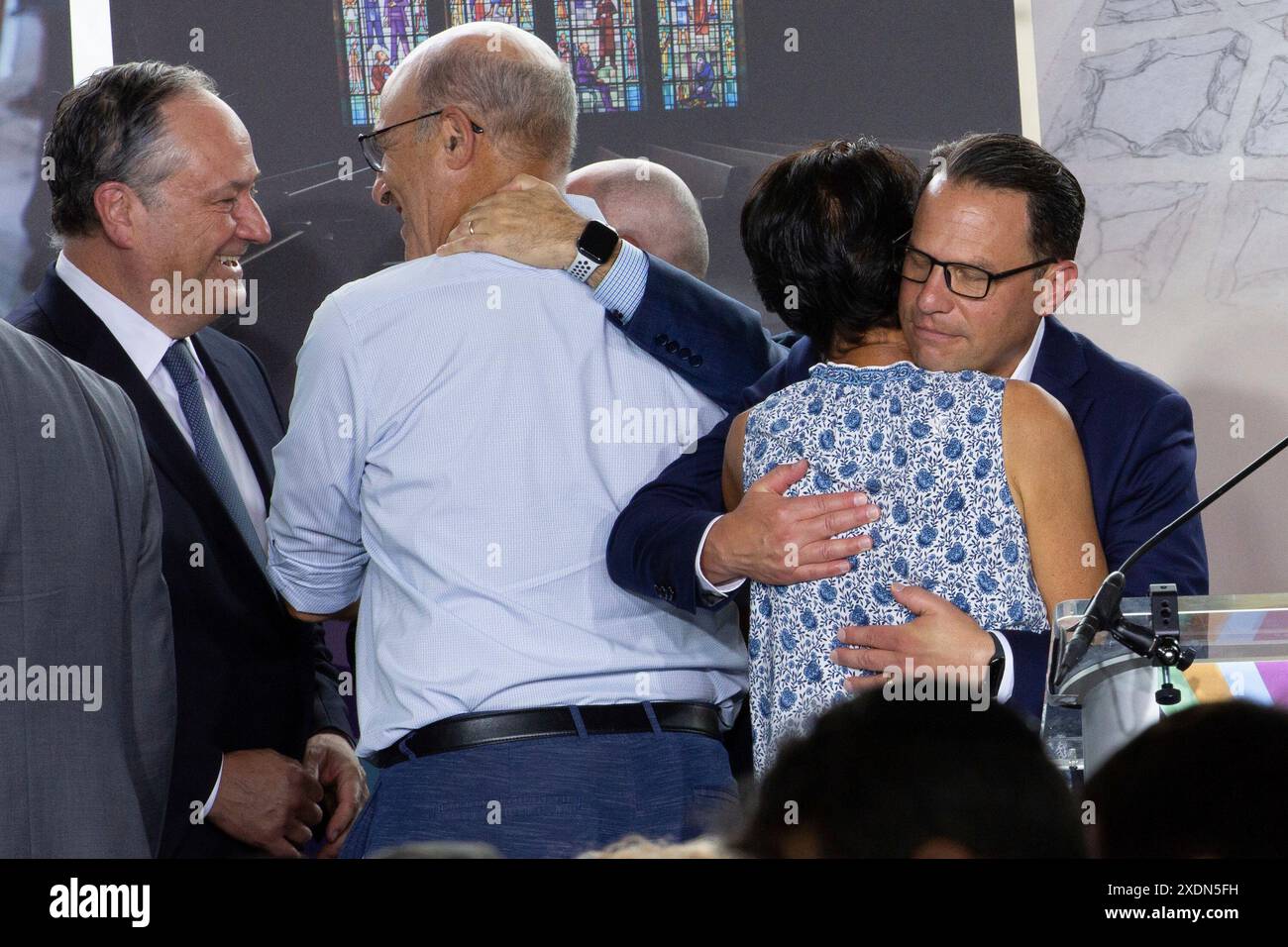 Second gentleman Doug Emhoff, left speaks with family and survivors of ...