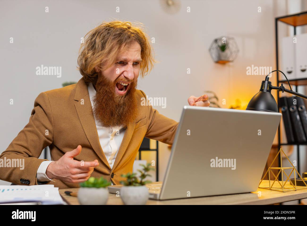 Upset business man arguing on laptop call online, displaying report ...