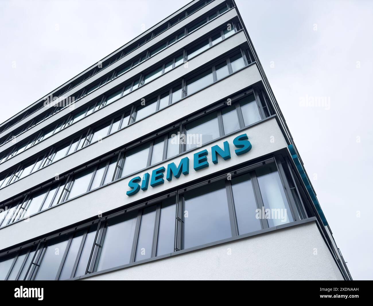 Freiburg, Germany - Mar 4, 2024: A wide-angle, low-angle view captures a large Siemens logotype ...