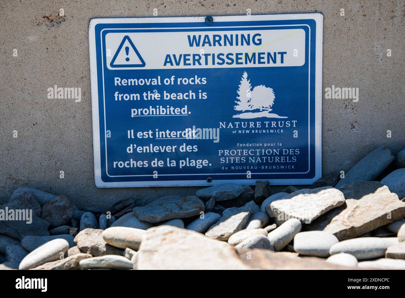 Nature Trust warning sign prohibiting removal of rocks at Pebble Beach ...