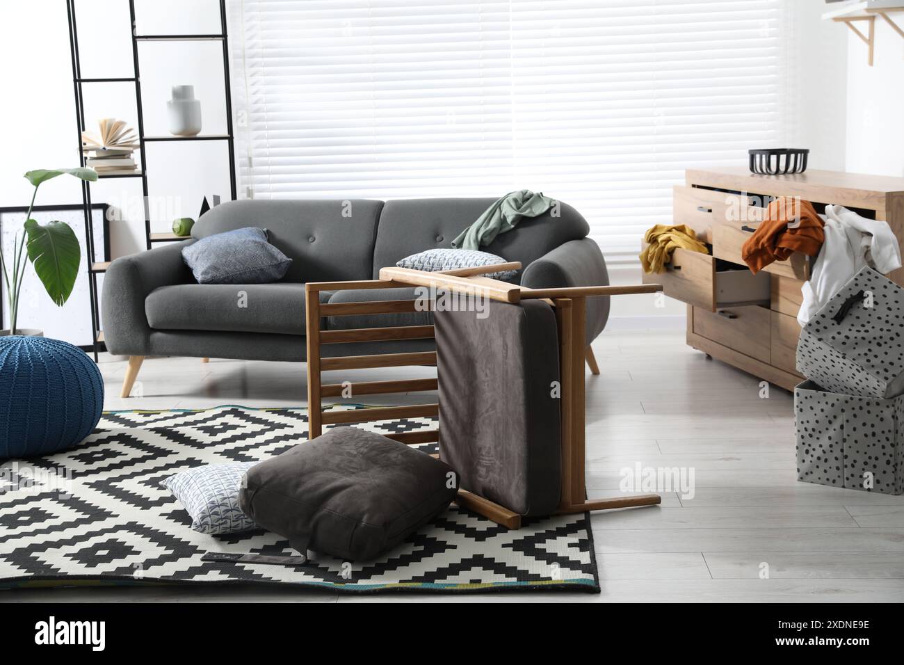 View on messy living room interior after robbery Stock Photo - Alamy
