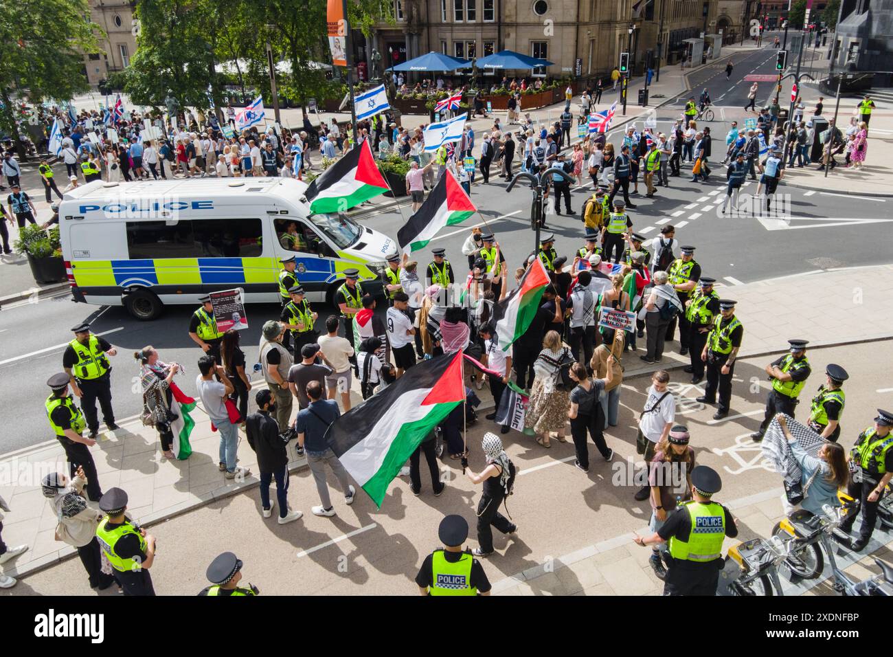 Leeds, UK. 23 JUN, 2024. Aerial view as police contain counter protest ...