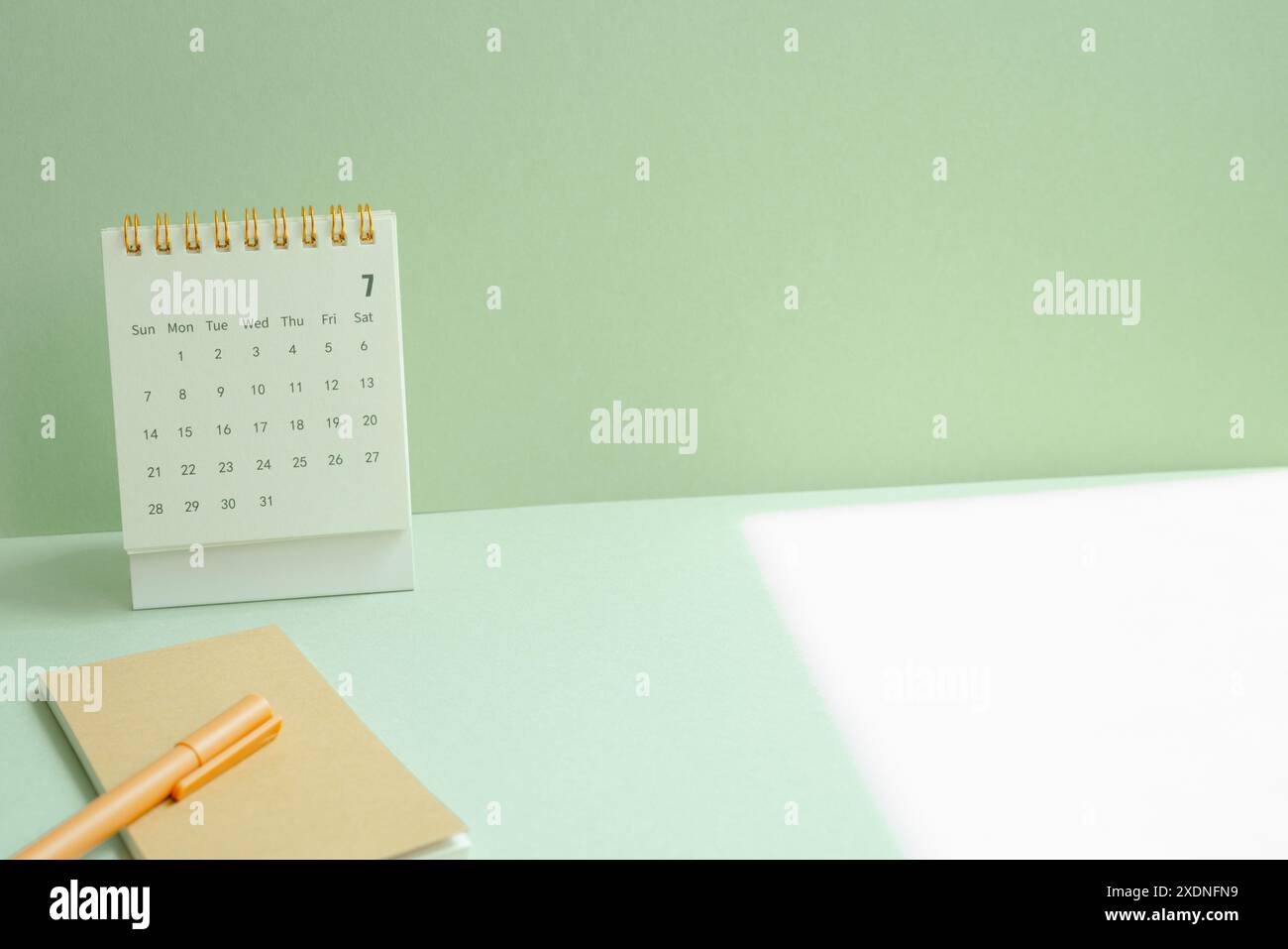 Calendar and notepad, pen for schedule, business, vacation plan on mint ...