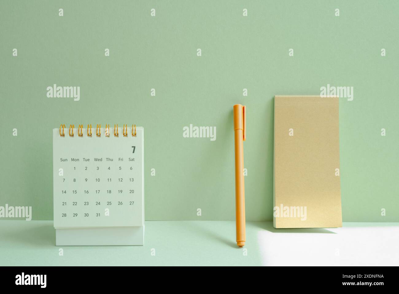 Calendar and notepad, pen for schedule, business, vacation plan on mint ...