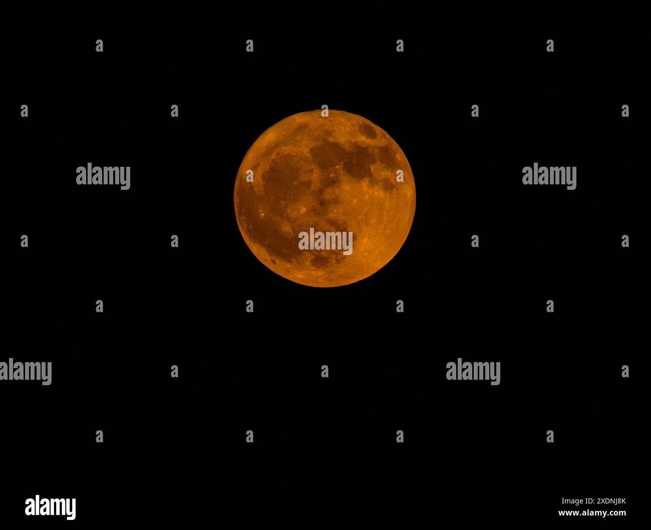 Closeup of the full summer solstice strawberry moon on June 21, 2024 as ...