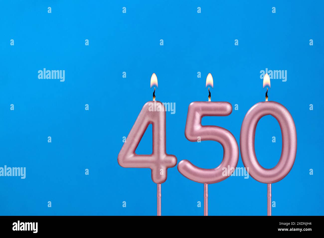 Birthday card with number 450 - Burning anniversary candle on blue ...