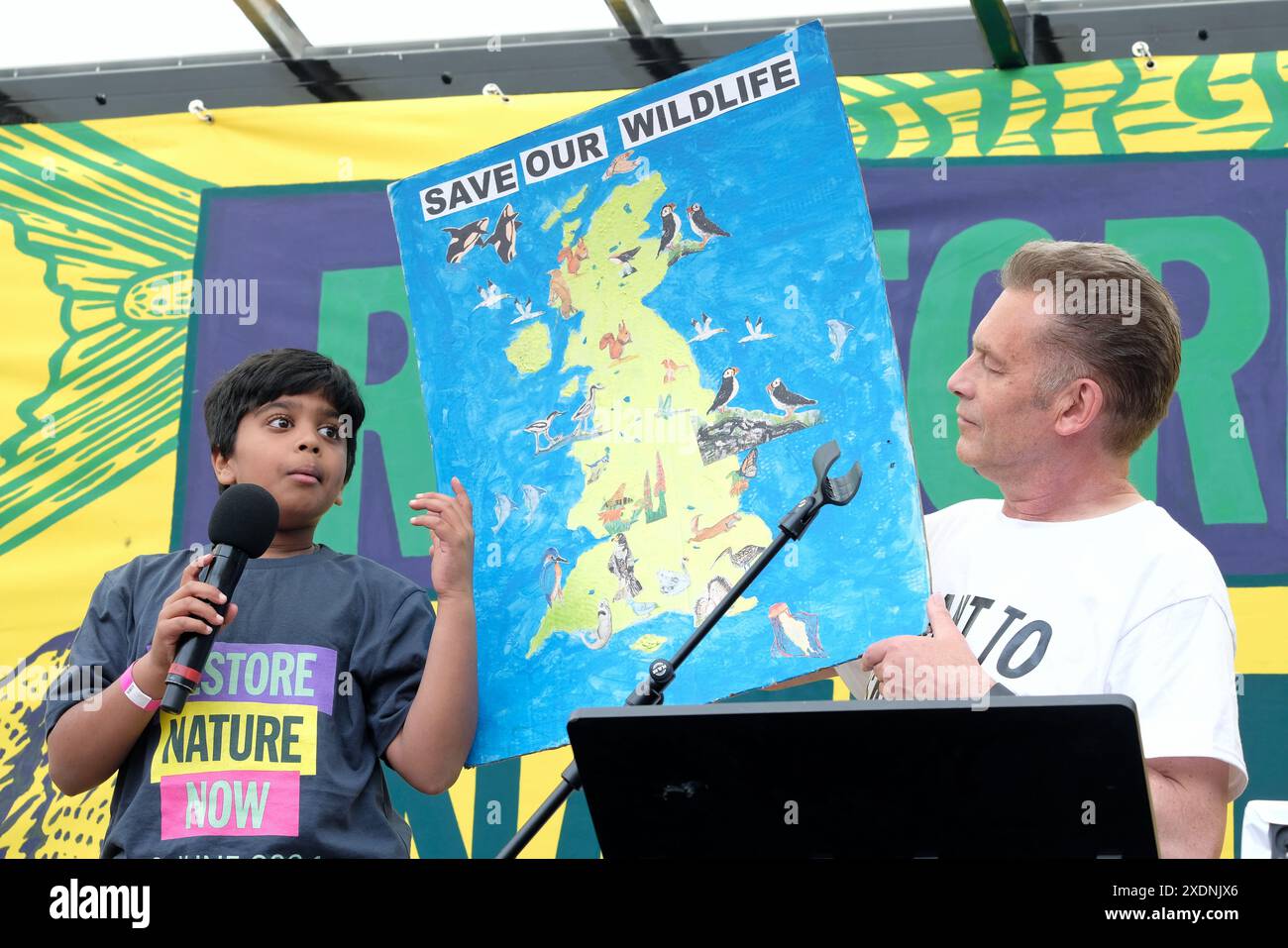 London, UK. A young environmentalist joins Chris Packham at the Restore ...