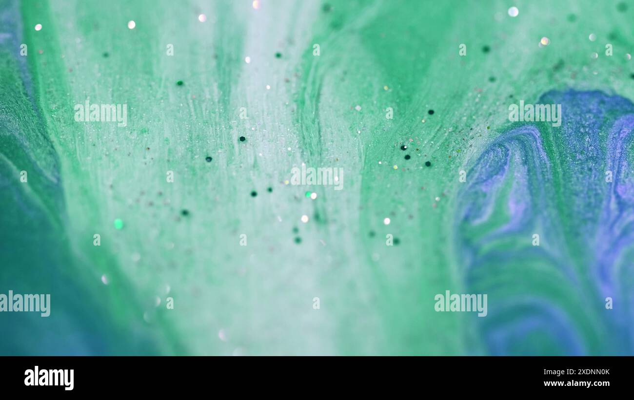 Sparkling fluid spill. Liquid glitter texture. Blur green blue color ...