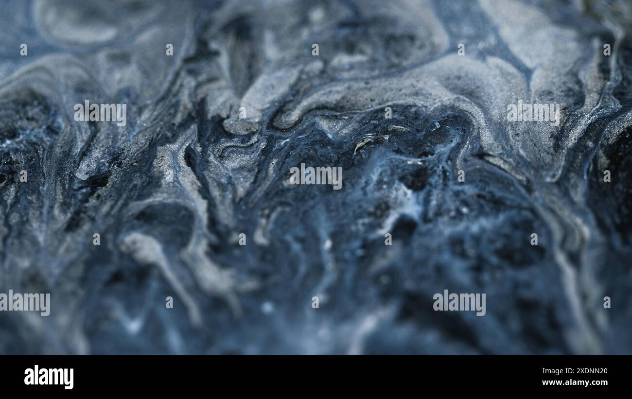 Liquid glitter spill. Shimmering paint. Defocused black silver color ...