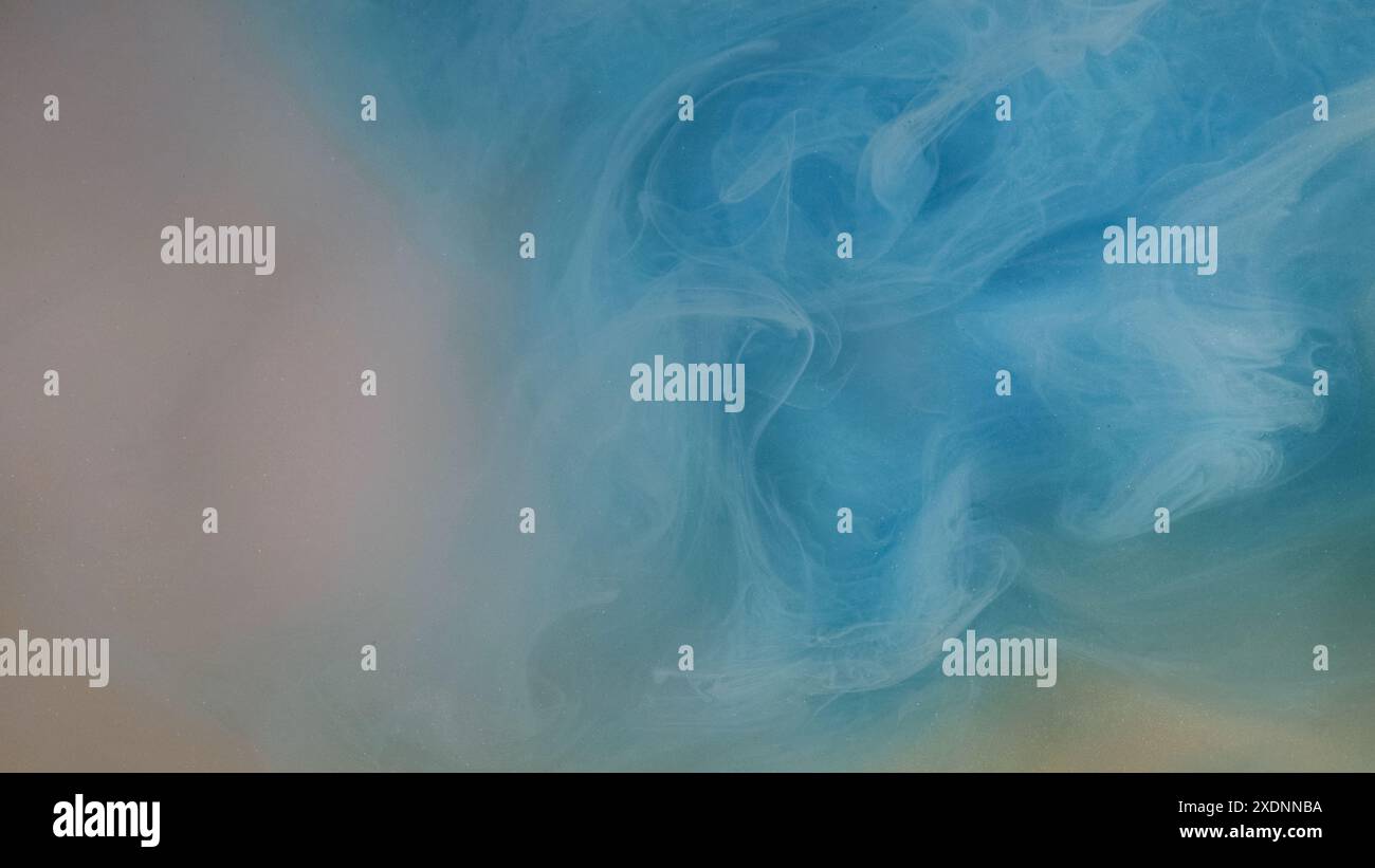 Smoke swirl. Paint water blend. Defocused blue white color glitter dust ...