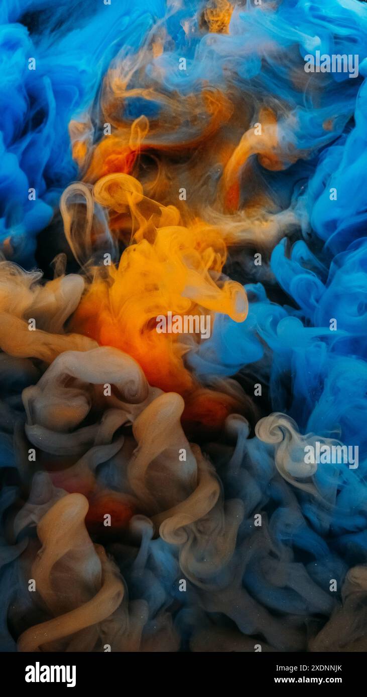 Color smoke cloud. Paint blend water. Defocused blue orange dust ...