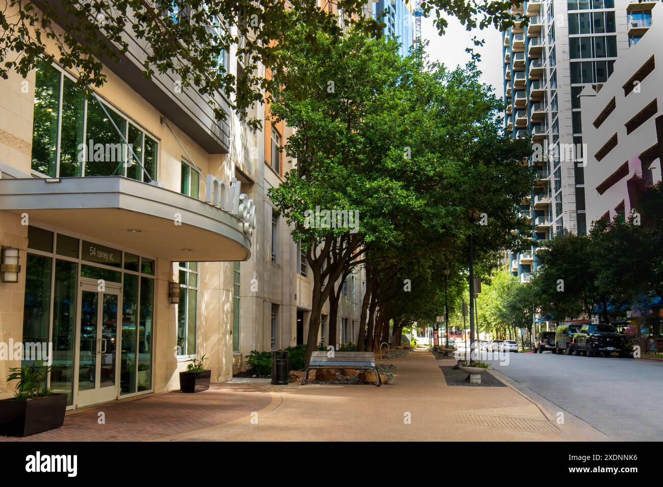 Famous Rainey Street in Austin, Texas, is shaded by mature trees lining ...