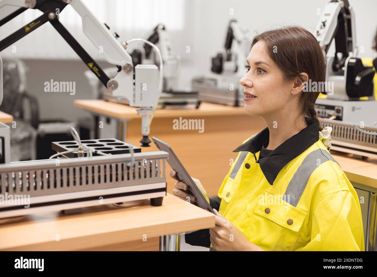 Engineer women learning education in Industrial Robotics program with ...