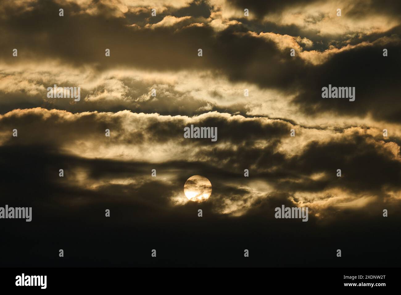 Berlin, Germany. 24th June, 2024. The rising sun comes out from behind ...