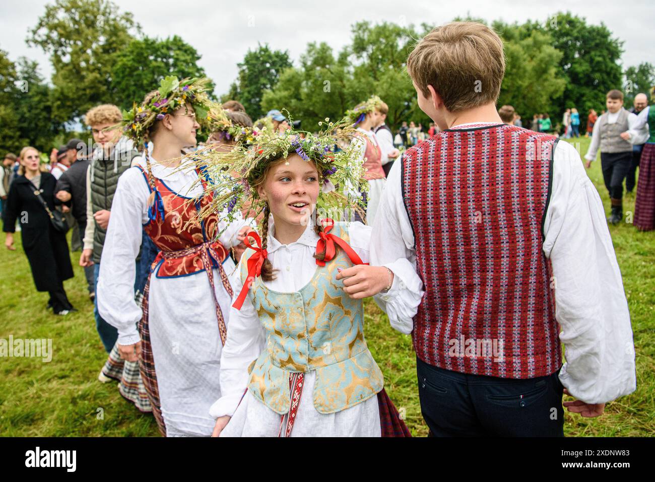 People dressed in traditional Lithuanian clothes dance as they ...
