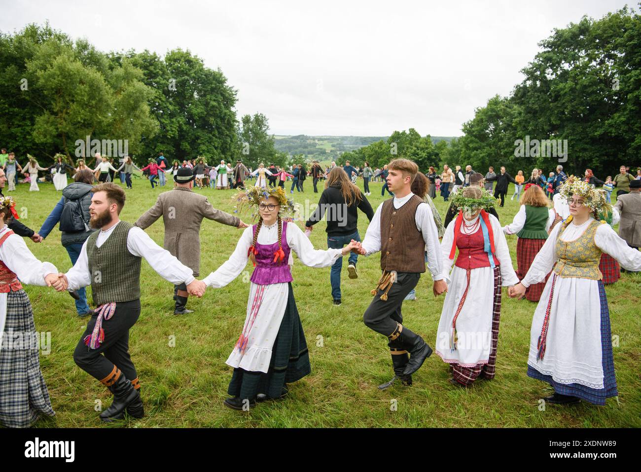 People dressed in traditional Lithuanian clothes dance as they ...