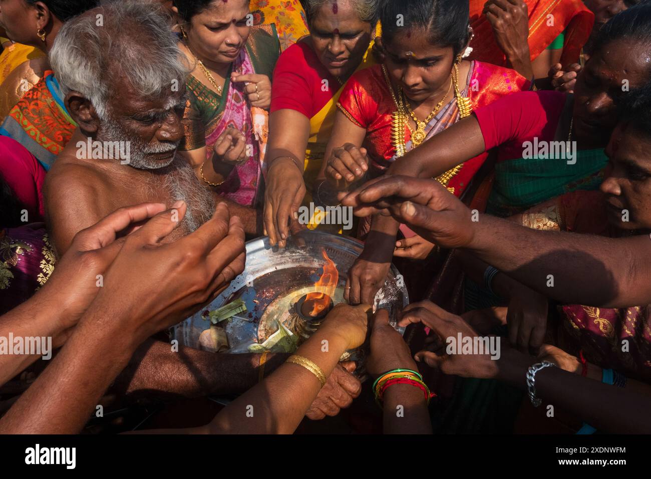 A hindu guru with a group of prayers at a temple festival Stock Photo ...