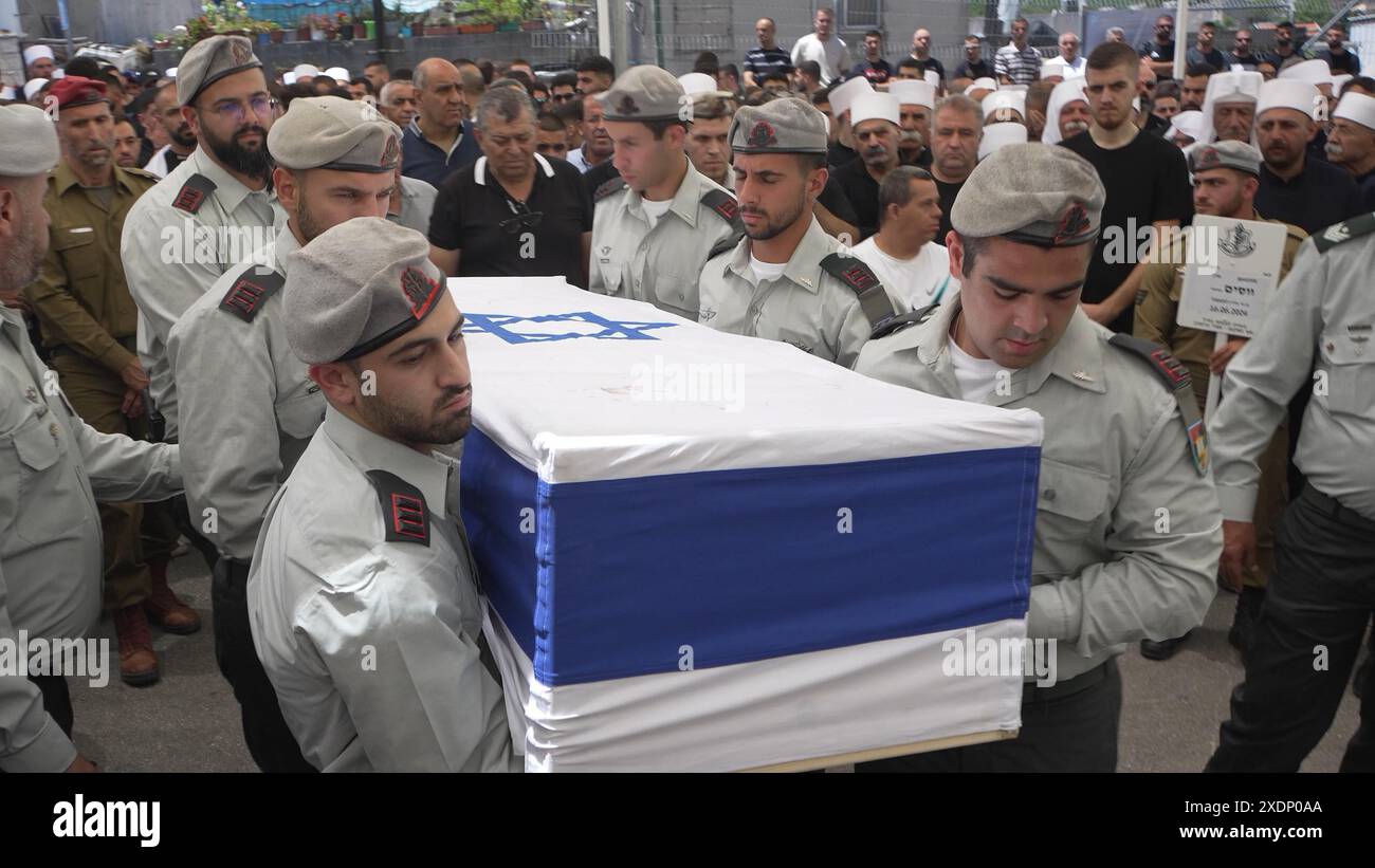 BEIT JAAN, ISRAEL - JUNE 16: Israeli soldiers carry the flag-draped ...