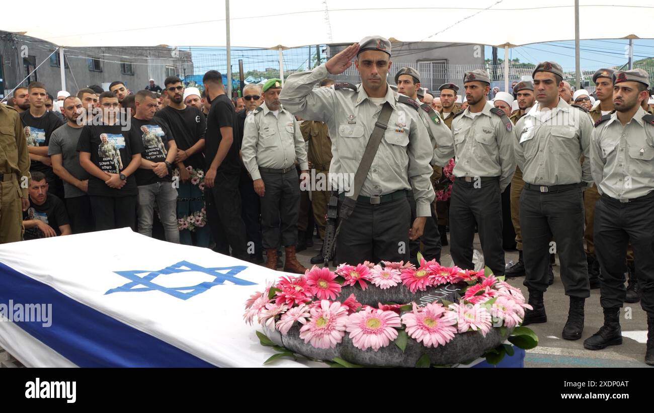 BEIT JAAN, ISRAEL - JUNE 16: Israeli soldiers lay wreaths on the flag ...