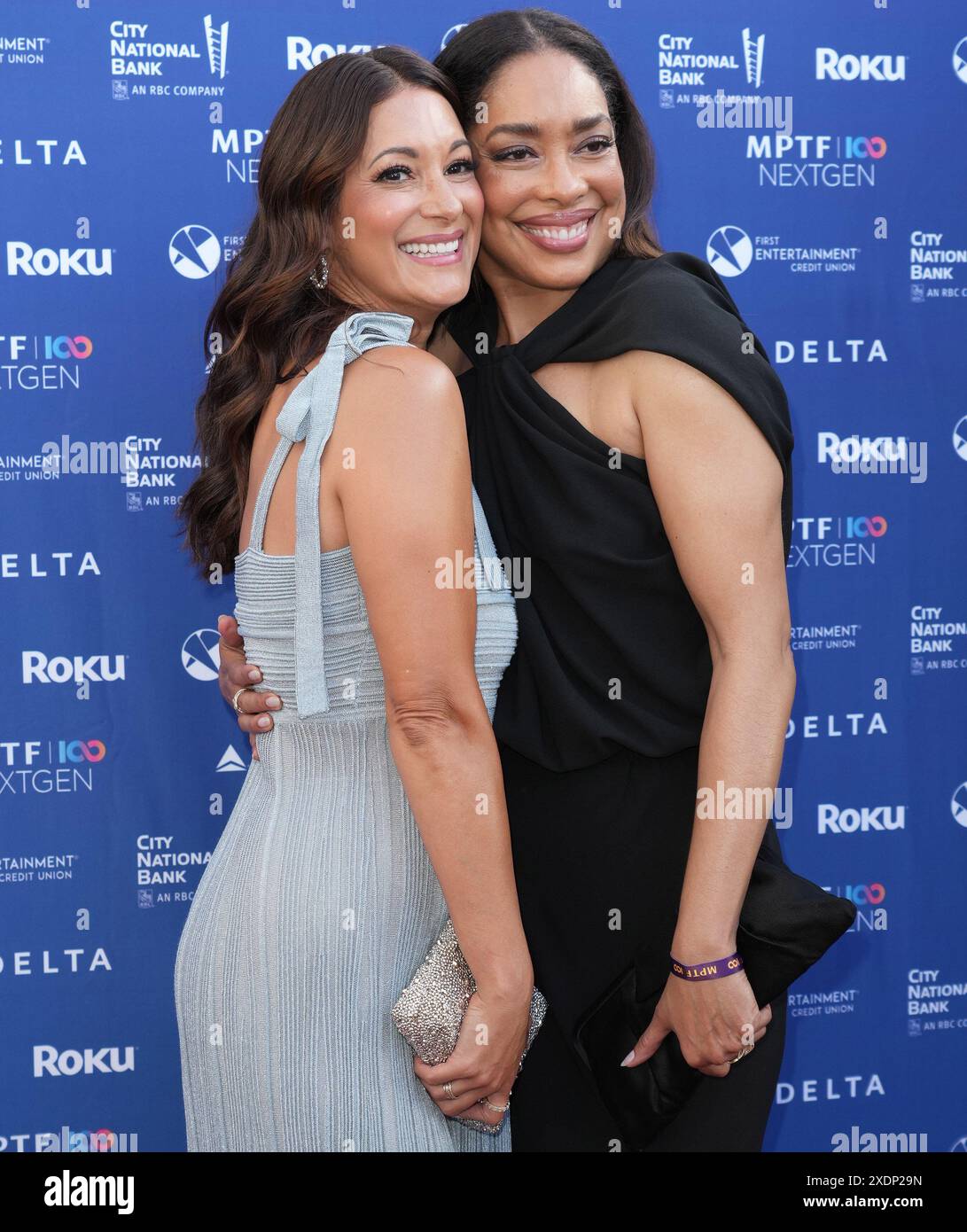 (L-R) Angelique Cabral and Gina Torres at the MPTF NextGen Summer Party ...