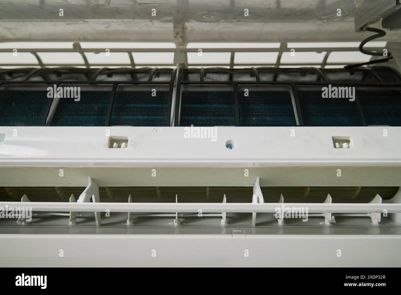White air conditioner unit is mounted on wall, ready for maintenance ...