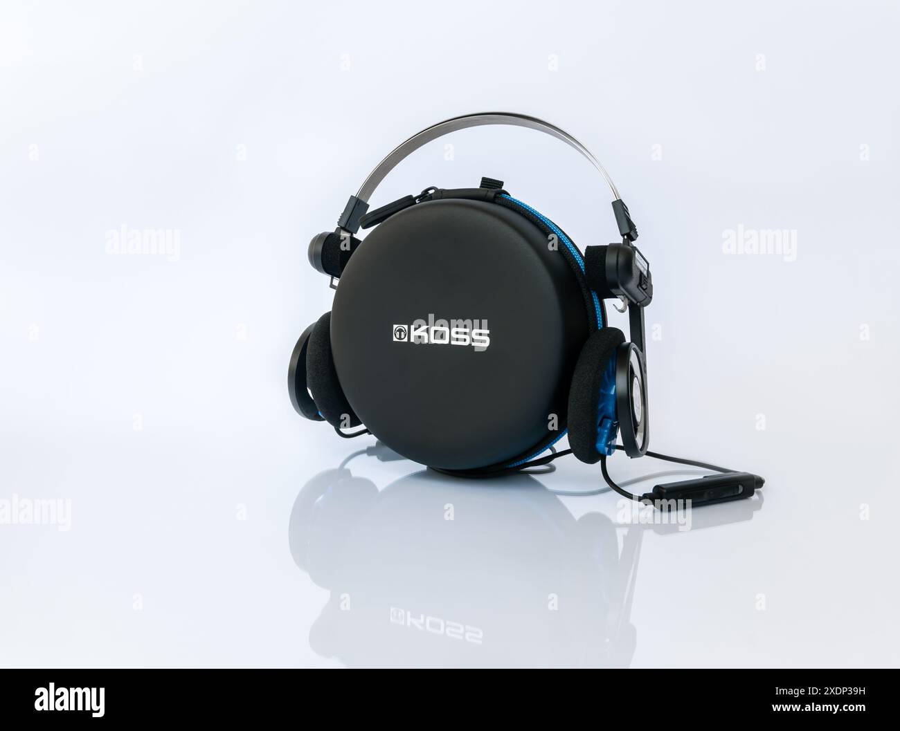 Koss Porta Pro Wireless headphones on a round transportation case like ...