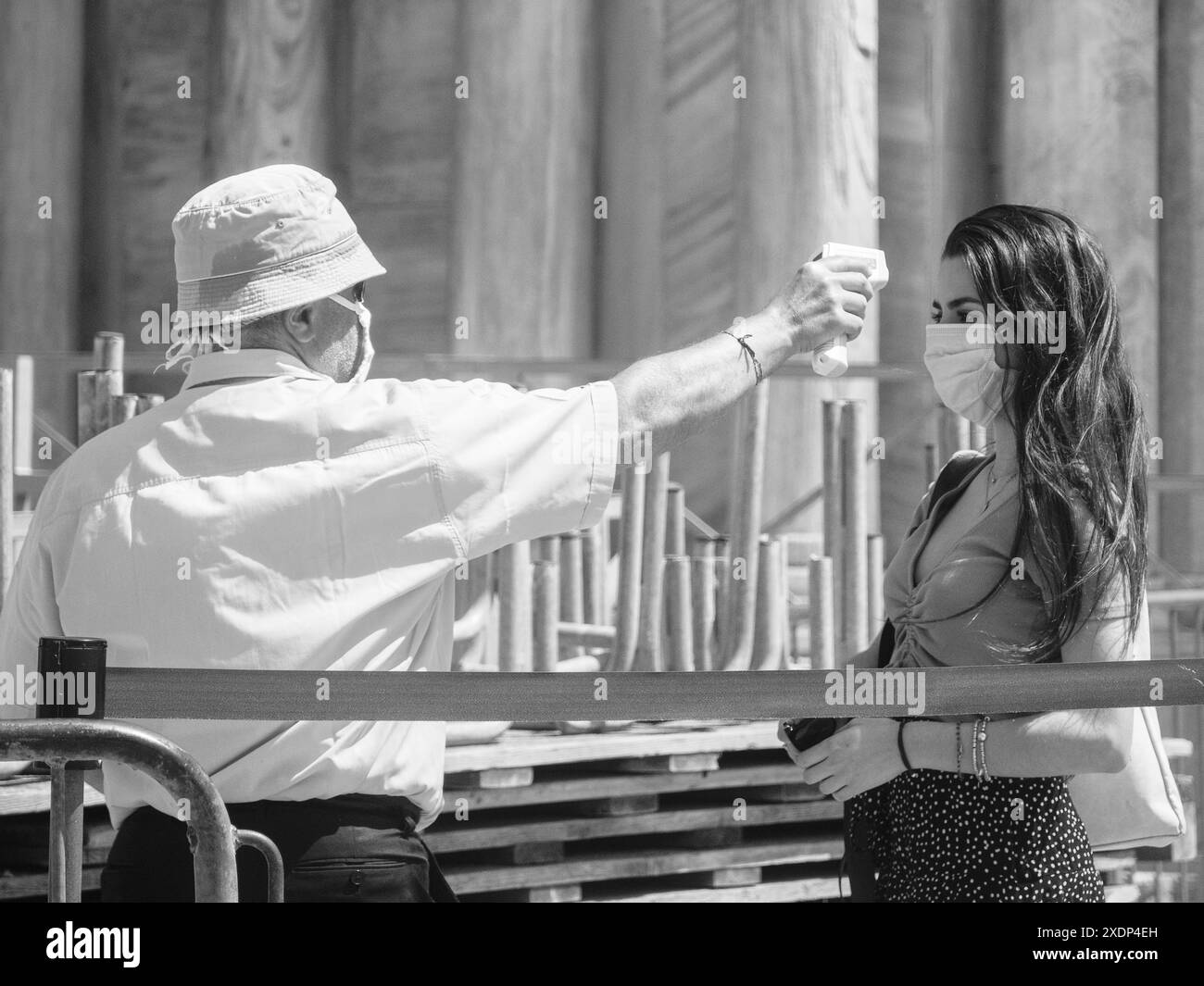 Venice, Italy - June 30th 20220 Security guard wearing a face mask is ...