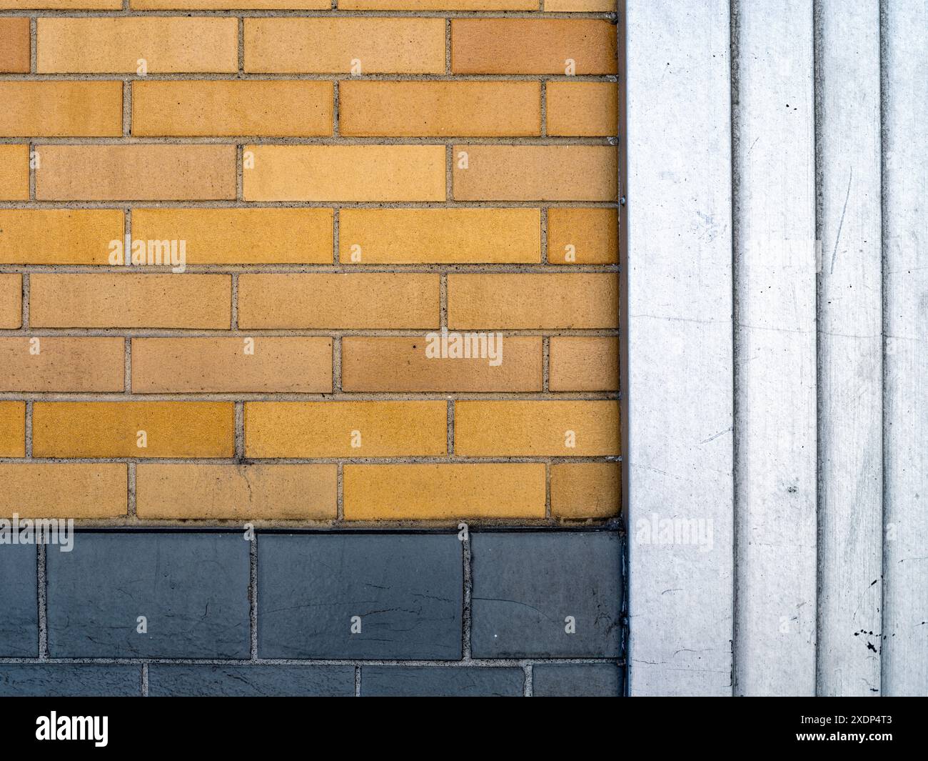 The section of an exterior wall of an old building with glazed bricks ...