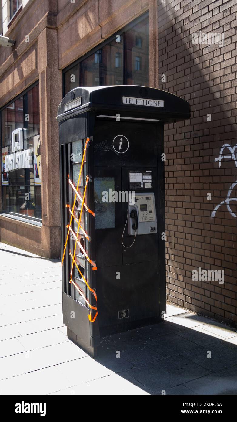 Vandalised telephone box in Liverpool city centre Stock Photo - Alamy
