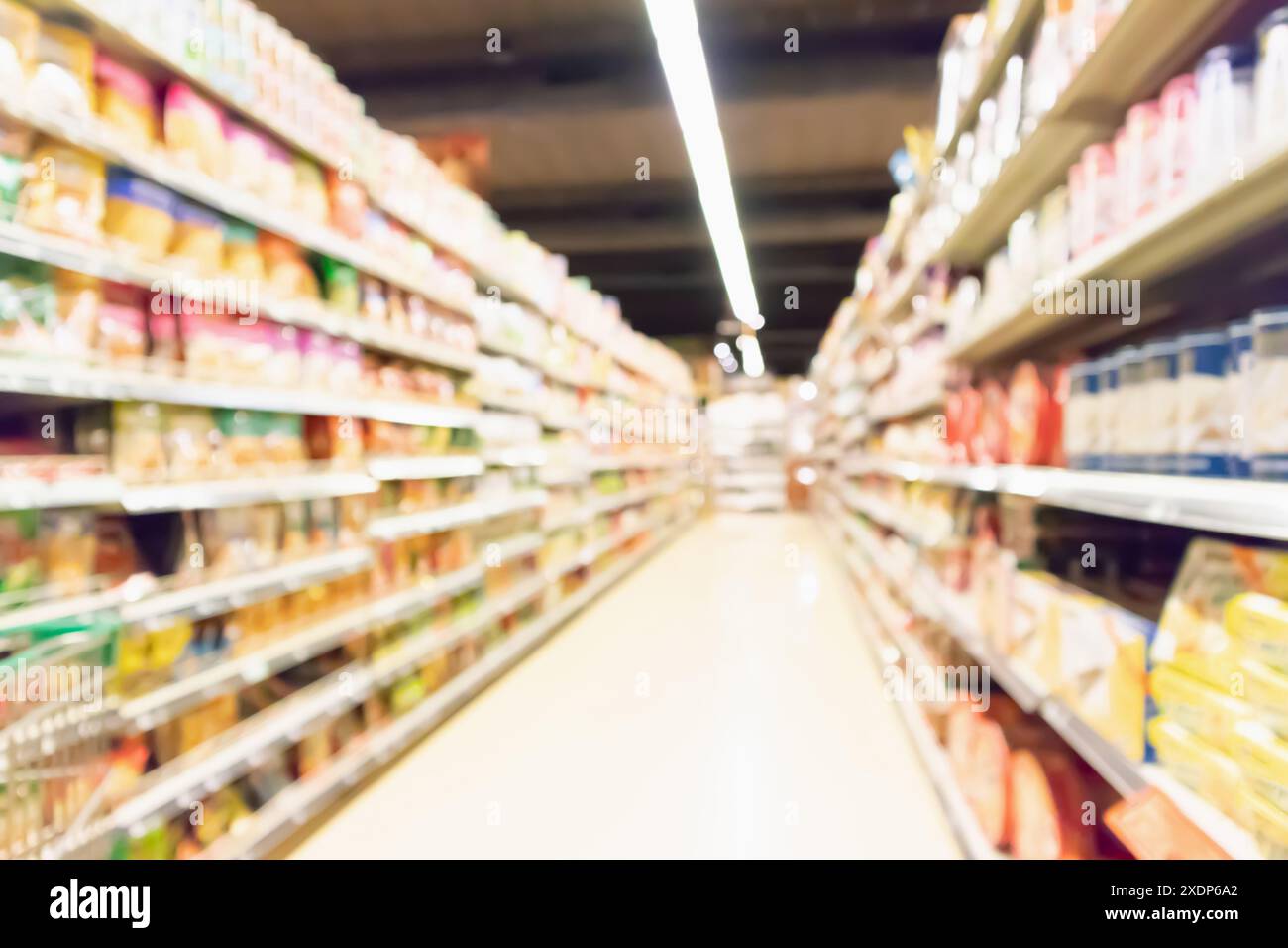 Abstract blur supermarket aisle with can food and snack product on ...