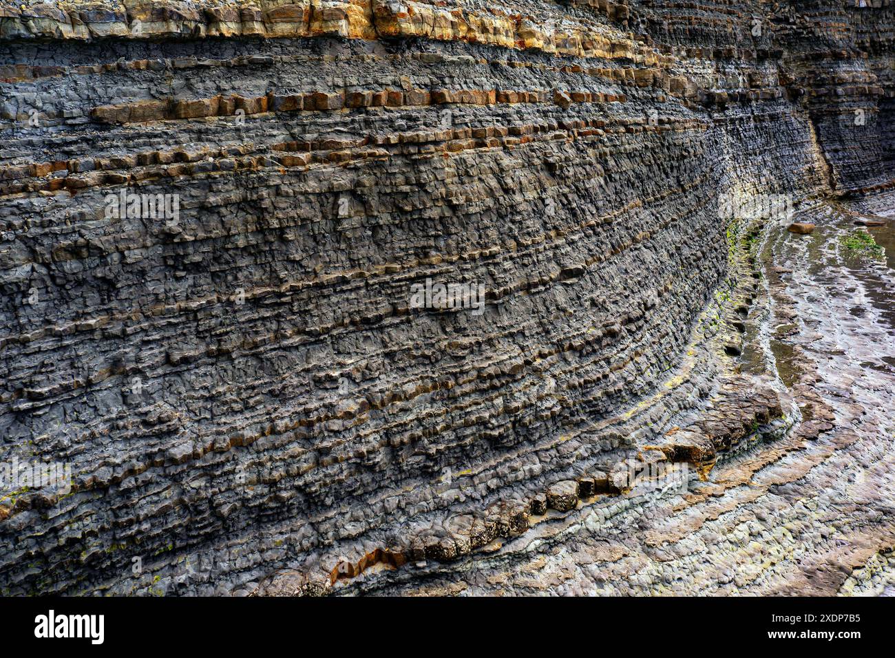 Geological rock layers exposed with erosion over millions of years ...