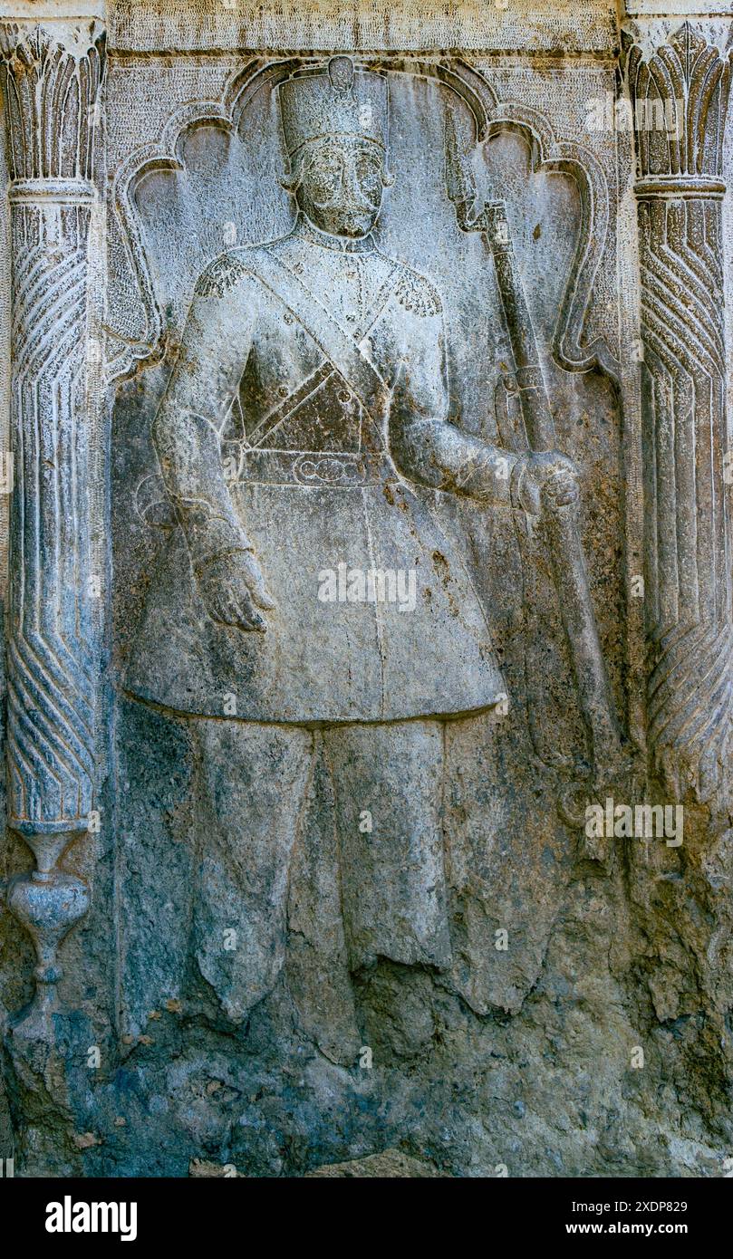 Stone carving of a Persian soldier Stock Photo - Alamy