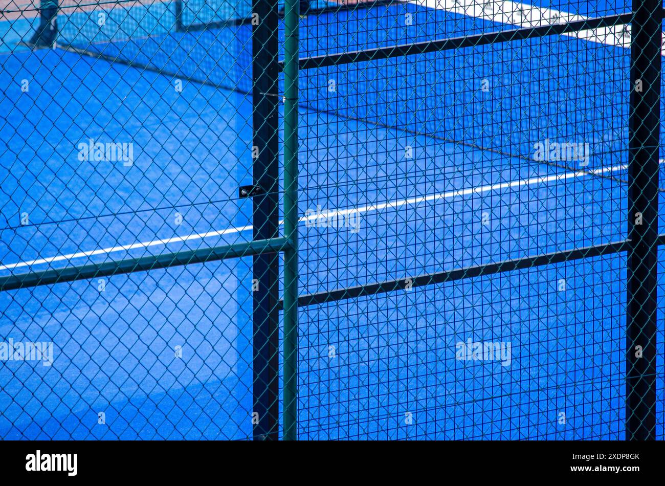 view from the outside of a blue paddle tennis court Stock Photo - Alamy