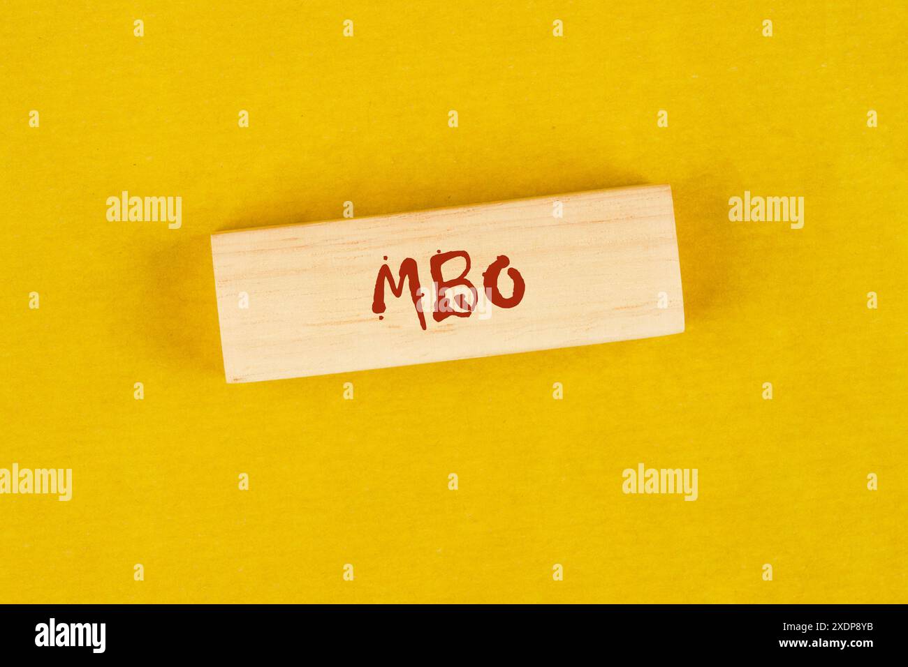 Management by Objectives MBO written on wooden blocks on a bright ...