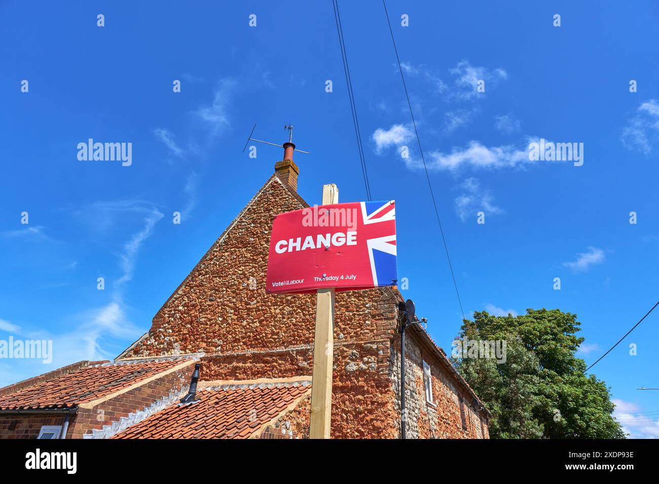 Labour party 2024 election campaign placard in a cottage garden in Old ...