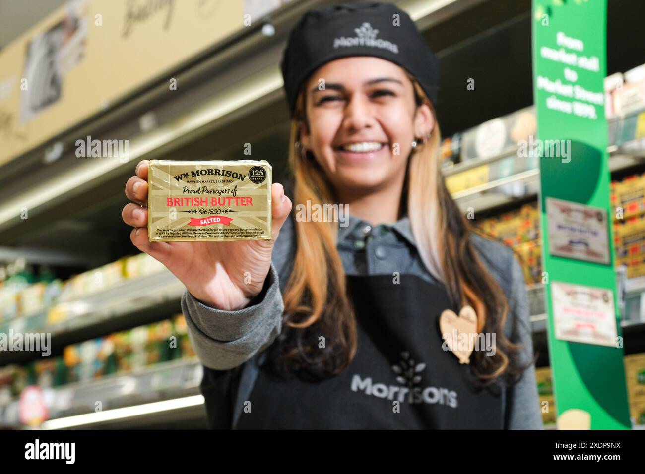 EDITORIAL USE ONLY Customer Assistant Flor unveils Morrison's limited ...