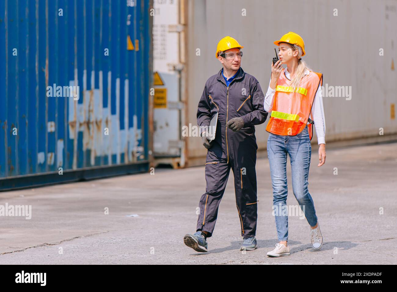 Group of Port Container Ship Yard Colleague Workers working together join teamwork control ...