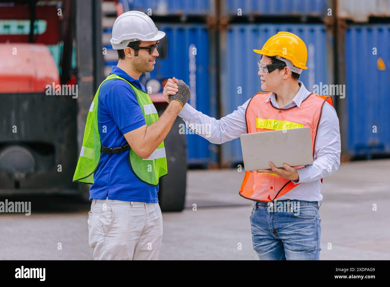 Group of Port Container Ship Yard Colleague Workers working together join teamwork control ...