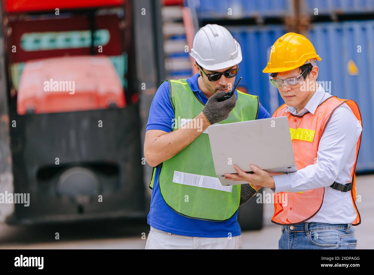 Group of Port Container Ship Yard Colleague Workers working together join teamwork control ...