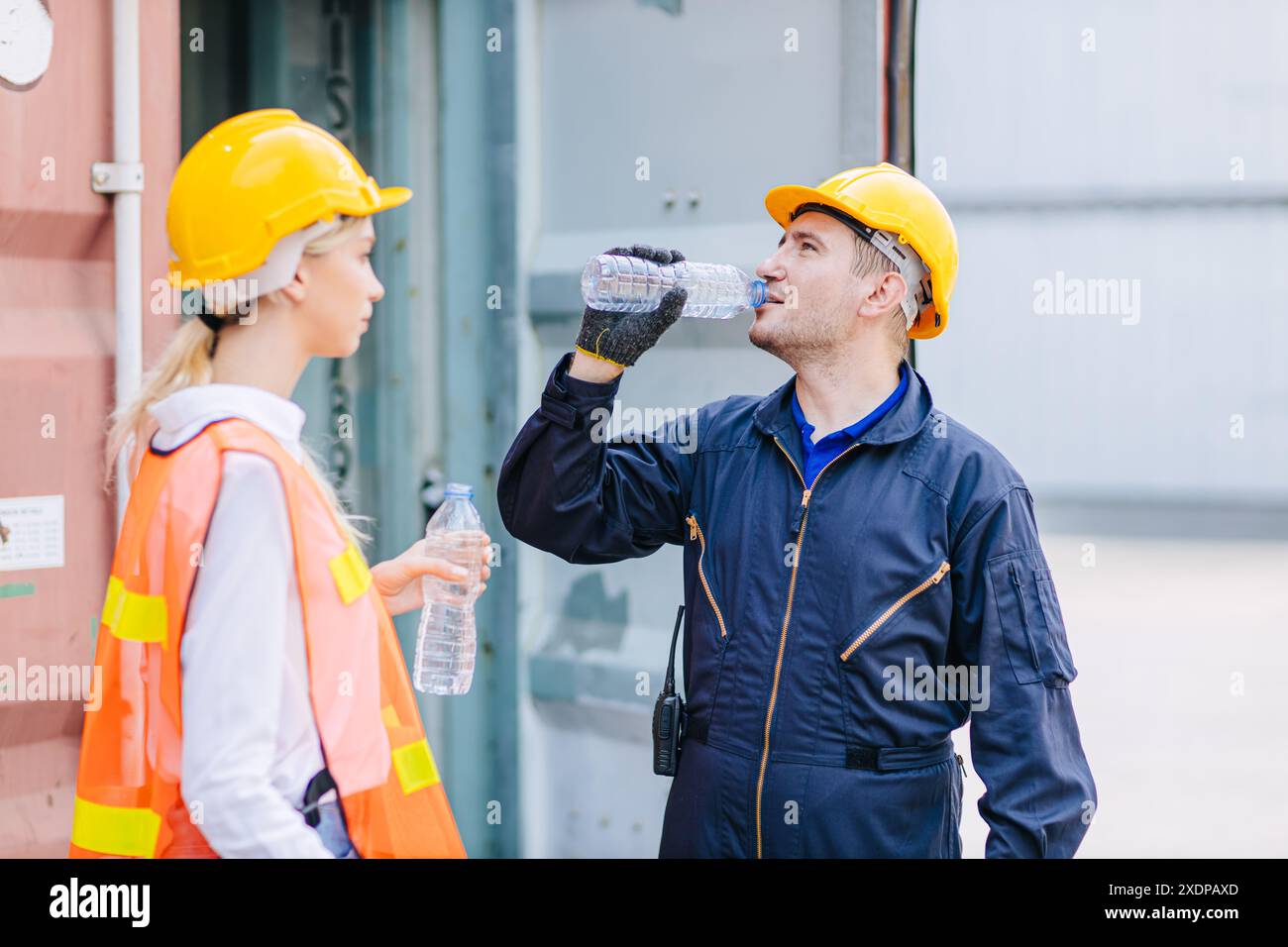 Happy Engineer team worker Thirsty Drinking Water brake relax healthy work in hot summer in port ...