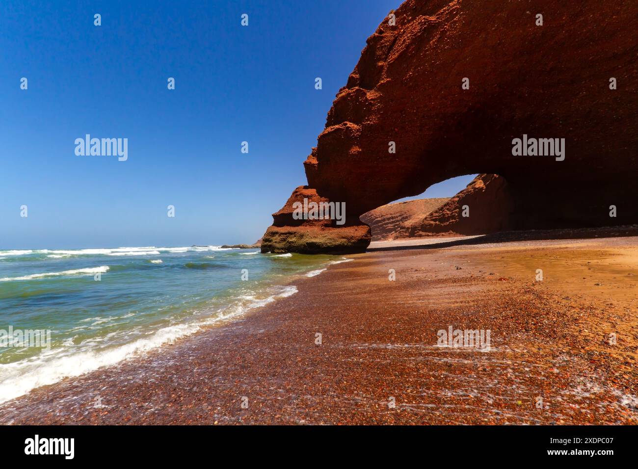 Spectacular natural red arch on atlantic ocean coast. Legzira ( or ...