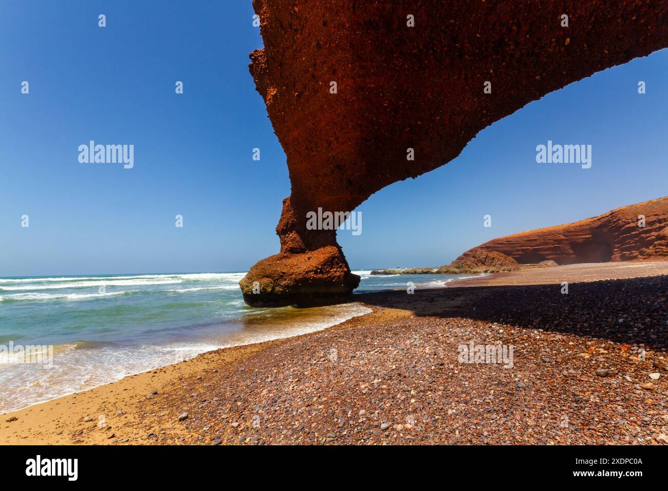 Spectacular natural red arch on atlantic ocean coast. Legzira ( or ...