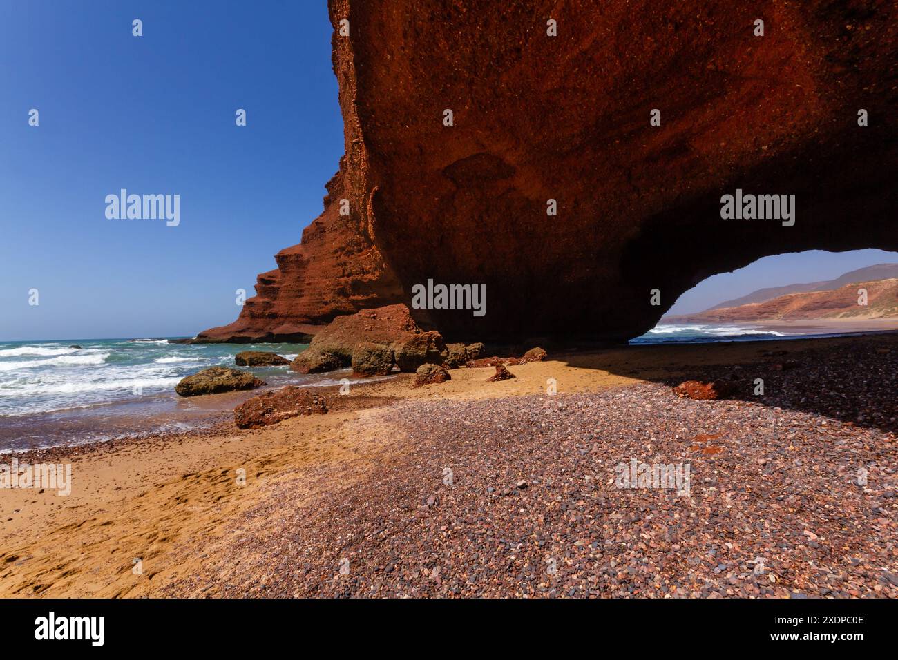 Spectacular natural red arch on atlantic ocean coast. Legzira ( or ...